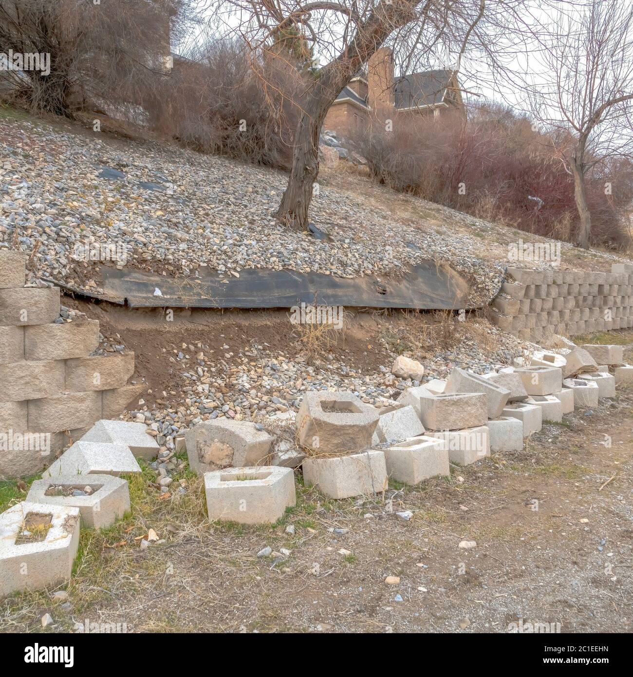 Square Neighborhood scenery with view of collapsed retaining wall made ...