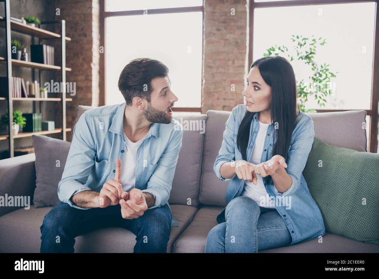 Portrait of frustrated couple have scandal woman count finger man fault ...