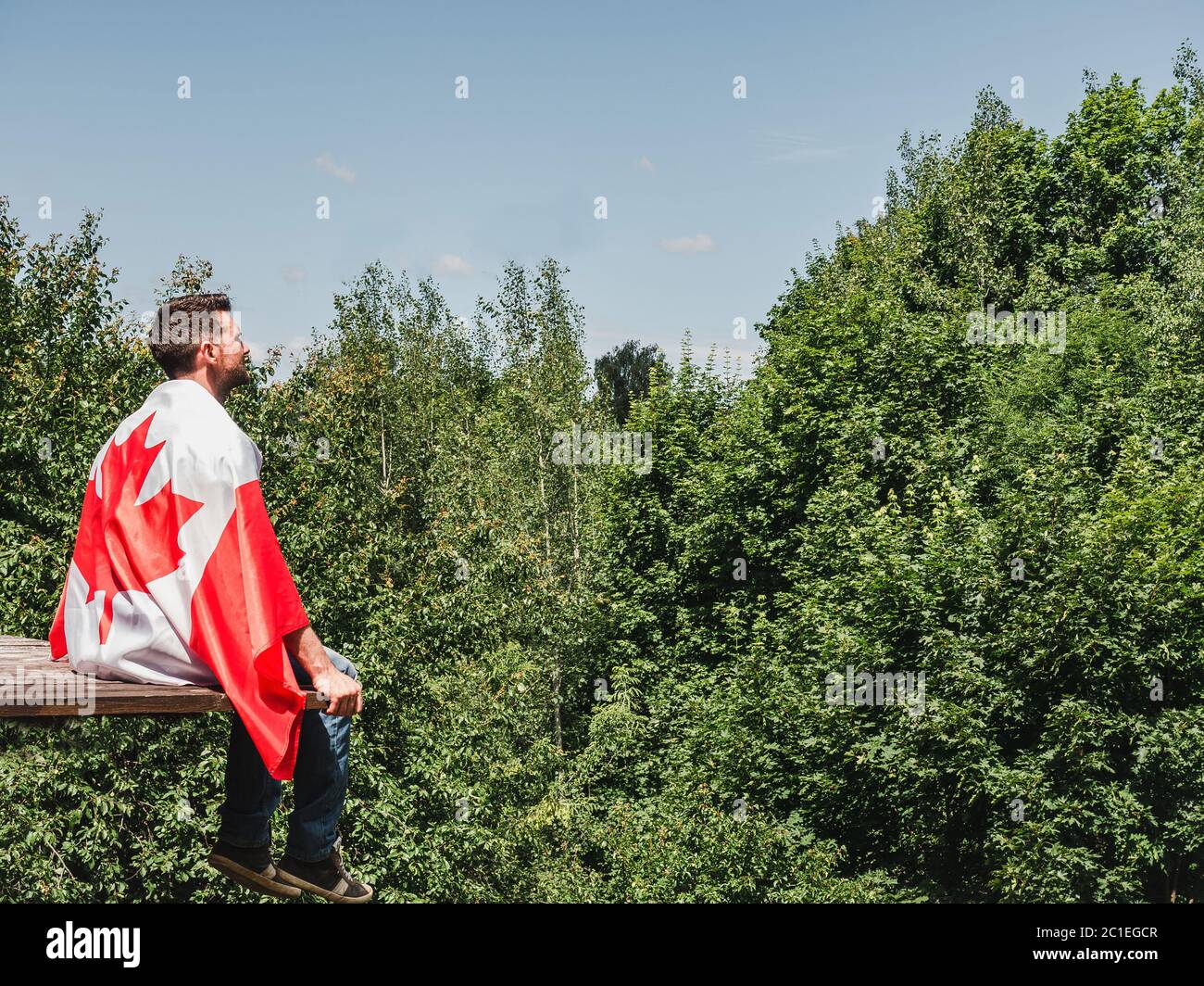 Attractive man holding Canadian Flag. National holiday Stock Photo - Alamy