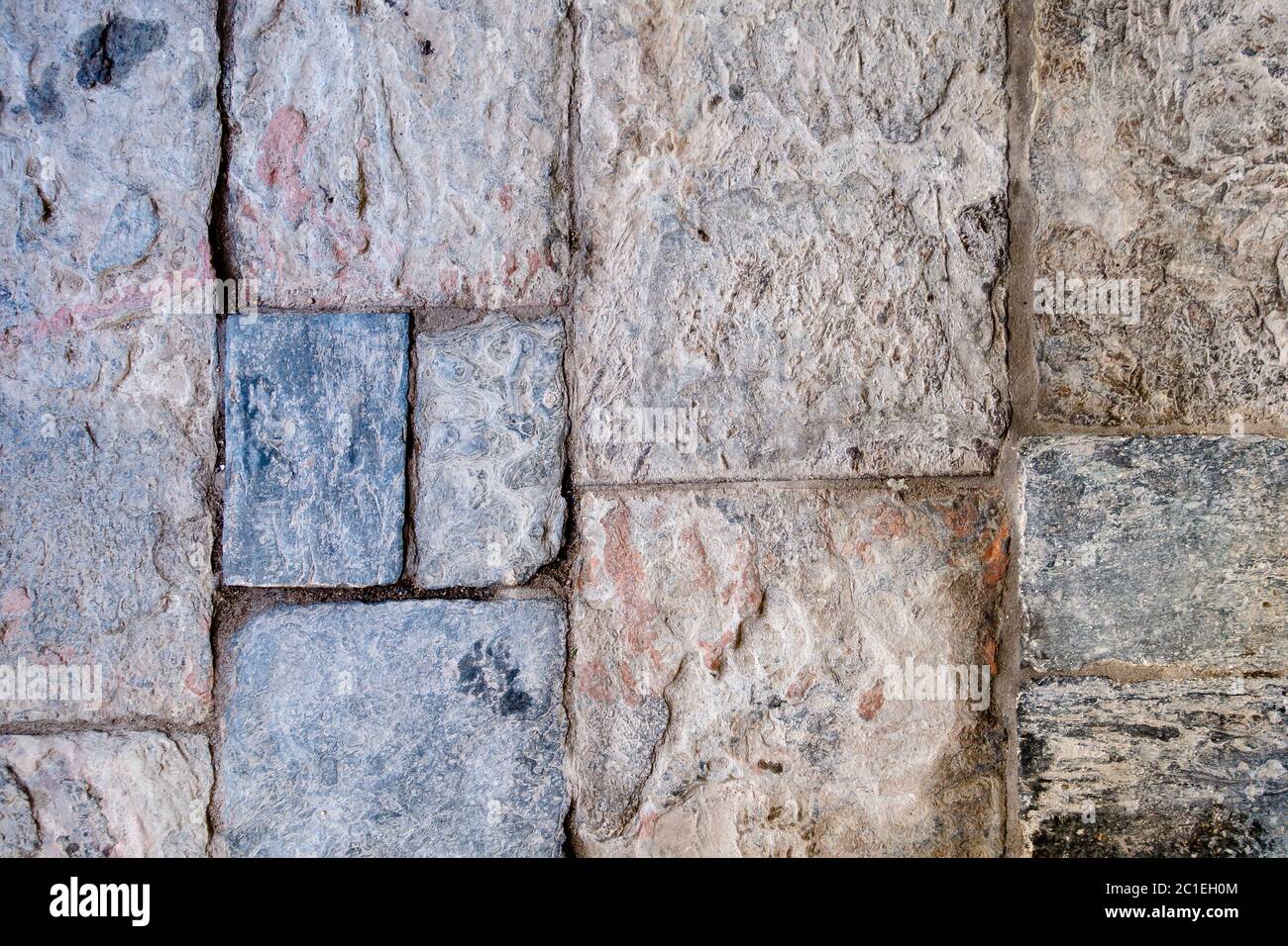 Detail of straight angle cobblestones of different sized in street in ...