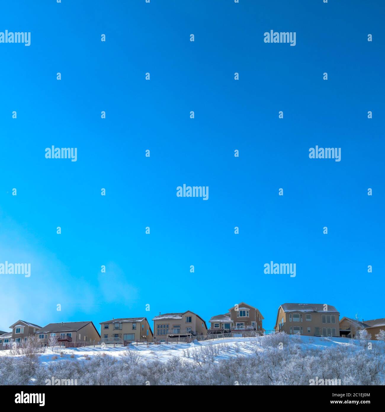 Square frame Row of houses on a neighborhood at the snowy terrain of ...