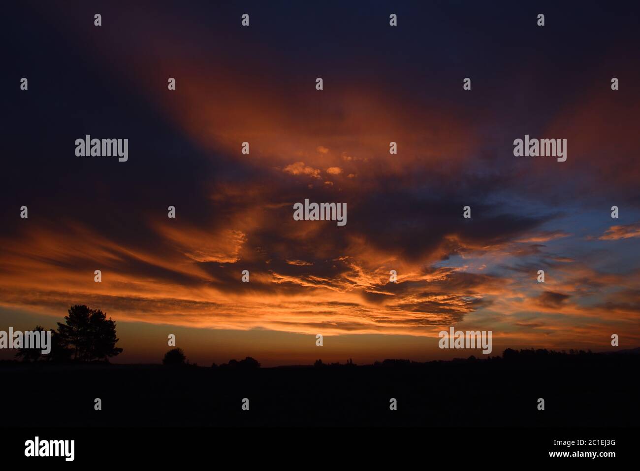 Sunrise with a dramatic sky Stock Photo - Alamy