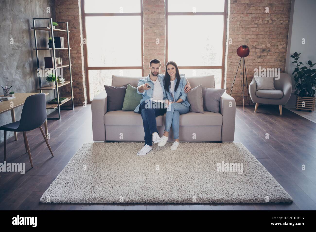 Full length photo of married couple focused man try find romantic film ...