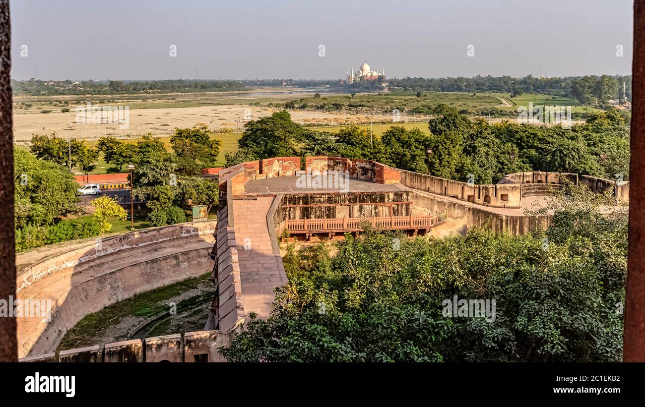 A view from Agra Red Fort window with fields and Taj Mahal in ...
