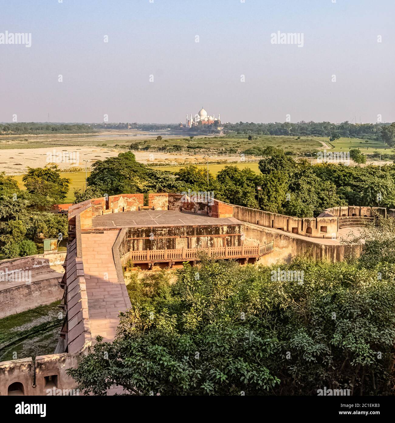 A view from Agra Red Fort window with fields and Taj Mahal in ...