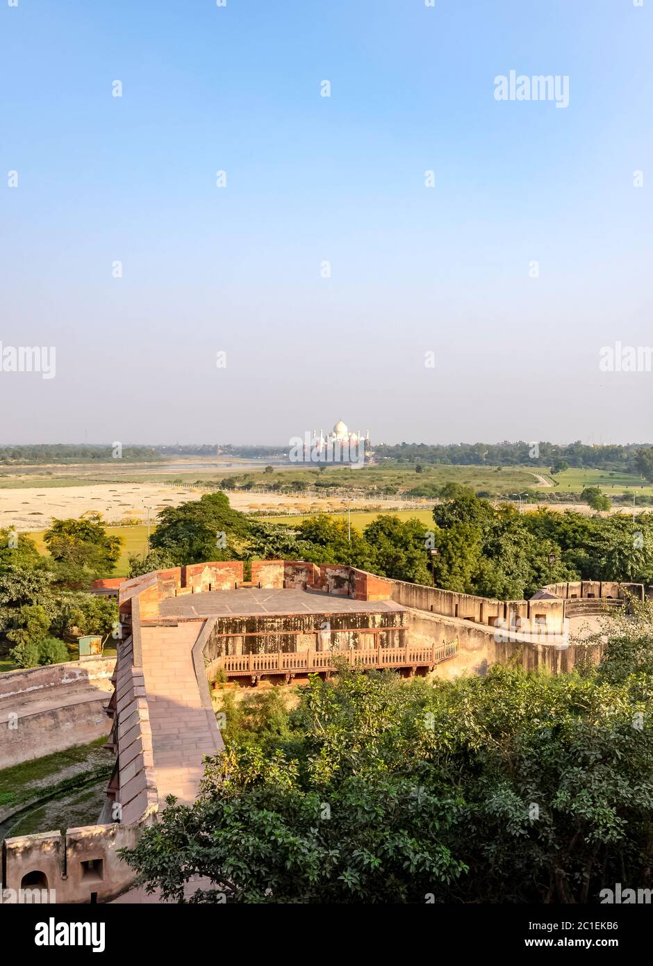 A view from Agra Red Fort window with fields and Taj Mahal in ...