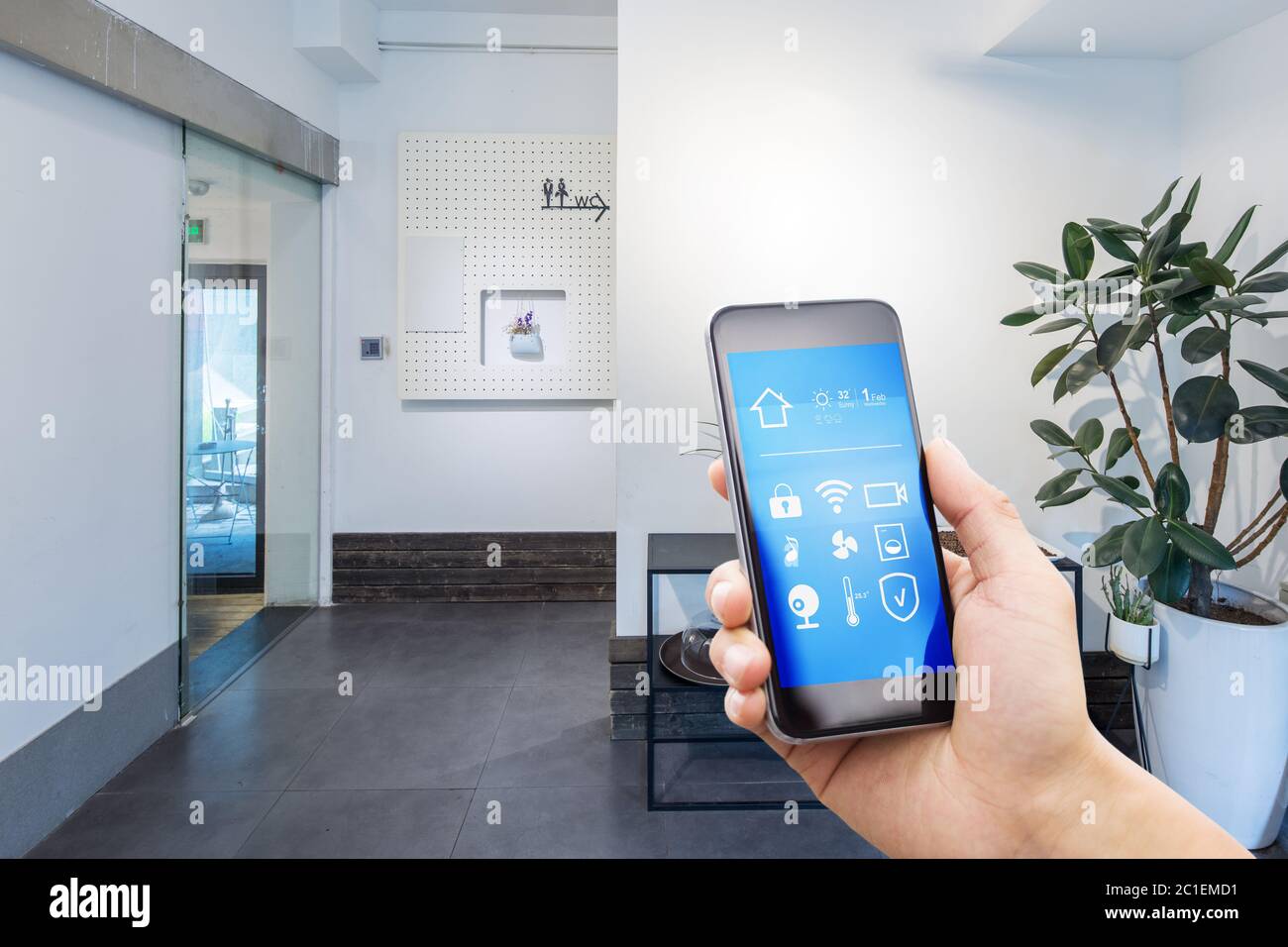mobile phone with smart home app in modern living room Stock Photo - Alamy