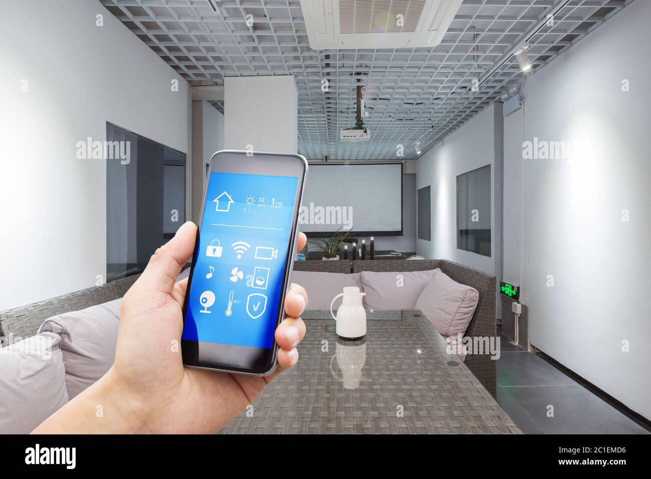 mobile phone with smart home app in modern living room Stock Photo - Alamy