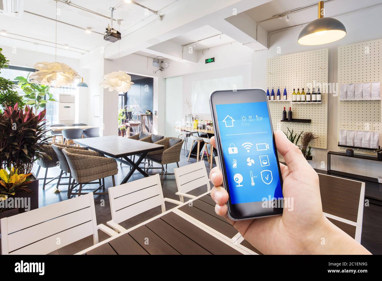 mobile phone with smart home app in modern living room Stock Photo - Alamy