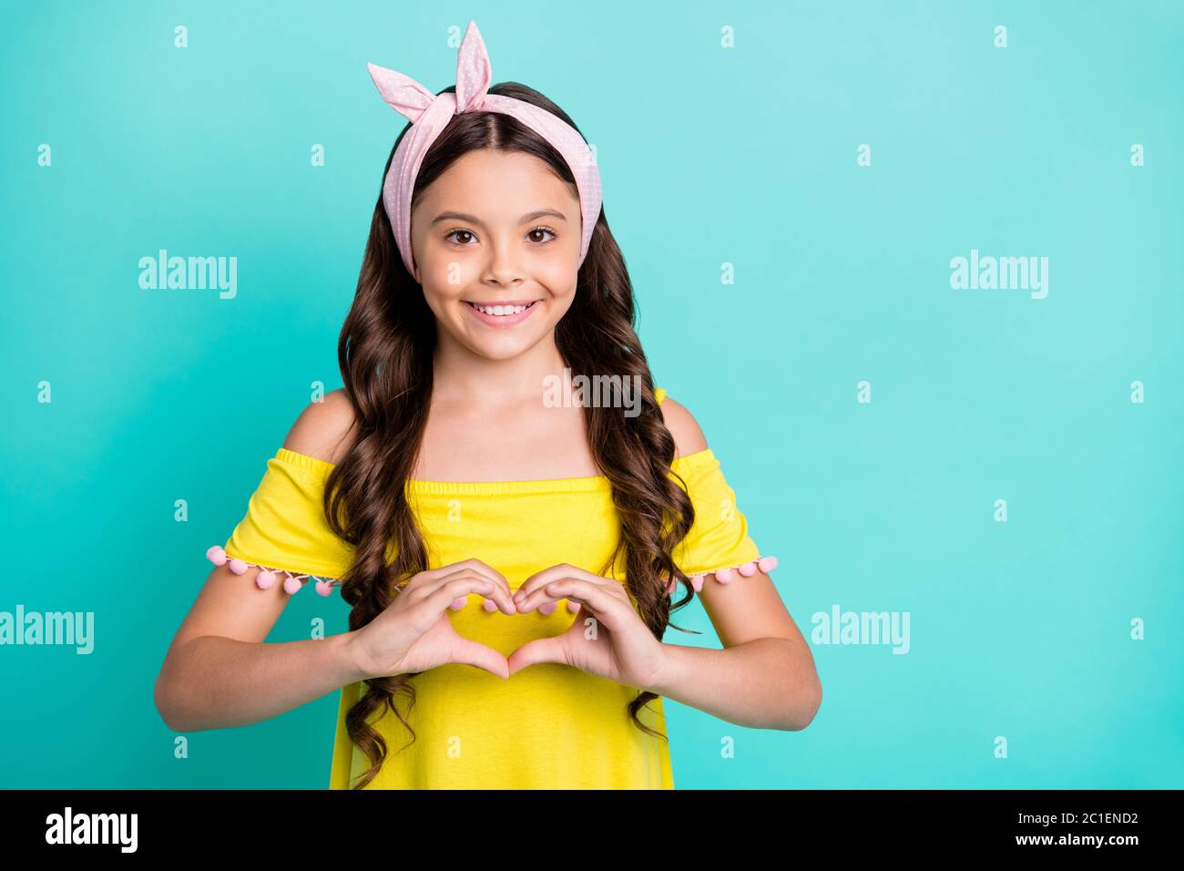 Portrait of positive girl make hands heart shape show love affectionate ...