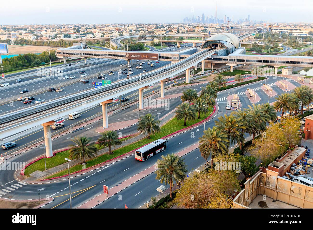 Aerial view of the city of Dubai, UAE, with Dubai's Metro Rail visible ...