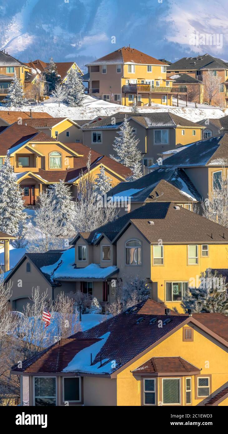 Vertical crop Homes of a mountainside residential community with views ...