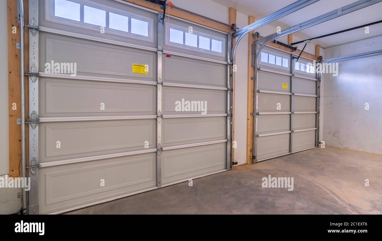 Panorama frame Inside an empty closed garage interior door Stock Photo ...