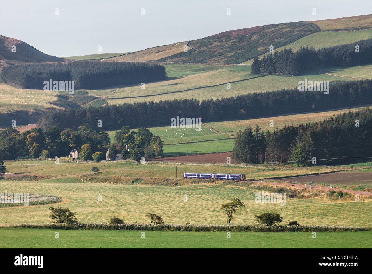 2 Scotrail class 158 trains passing the countryside at Ferniehirst on ...