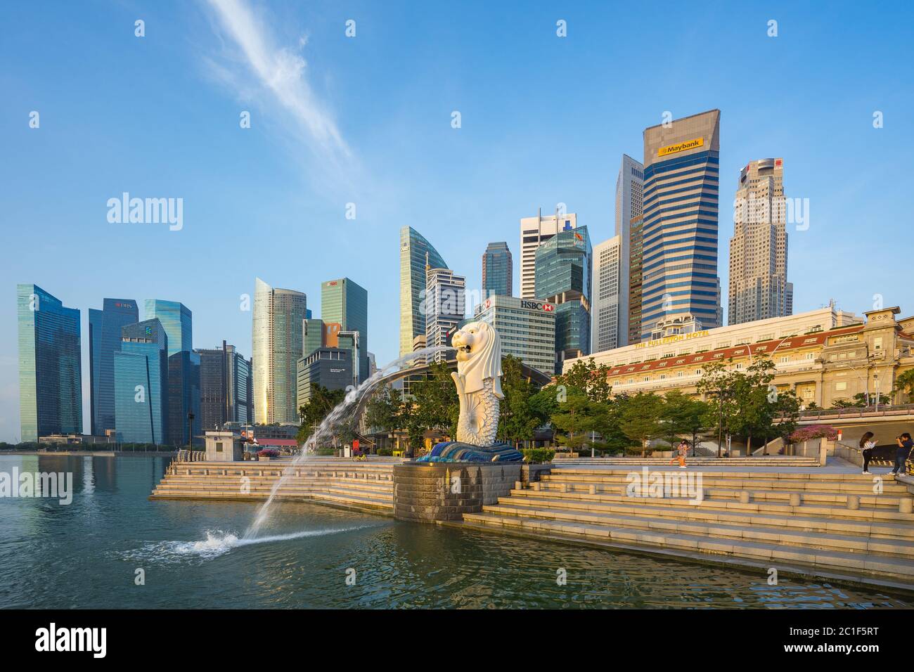 Singapore Merlion Park with view of modern buildings in city center of ...
