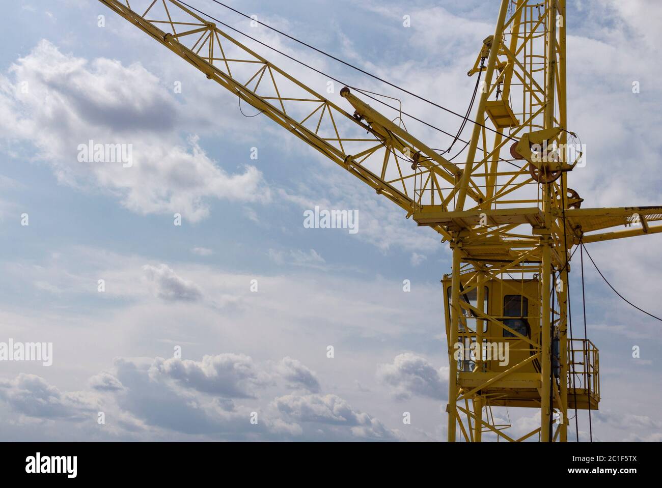 construction crane against the sky and clouds. high-rise building ...