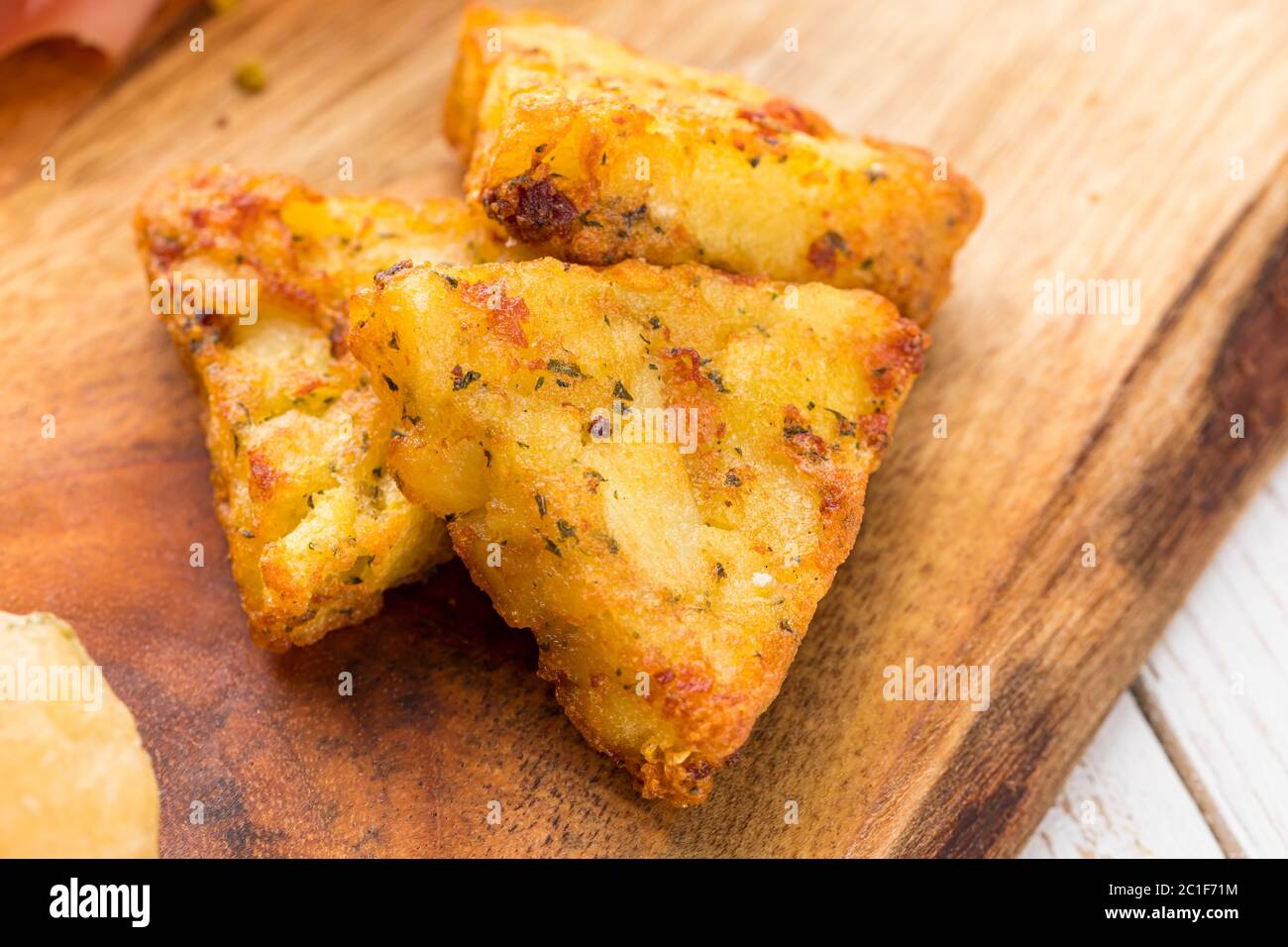 Cold cuts and fried appetizer on wooden cutting board Stock Photo - Alamy