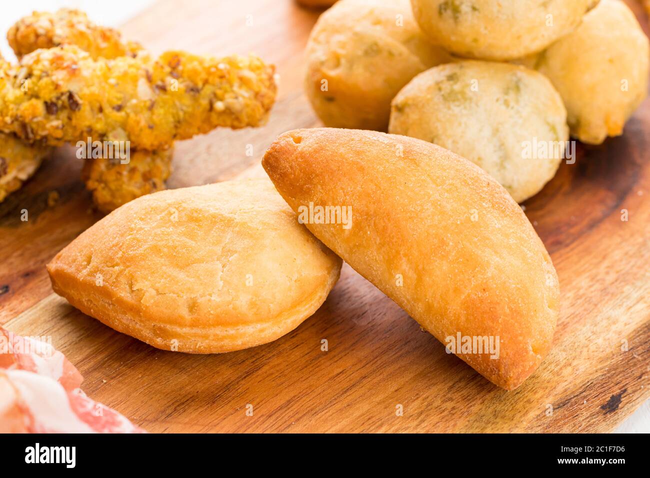 Cold cuts and fried appetizer on wooden cutting board Stock Photo - Alamy
