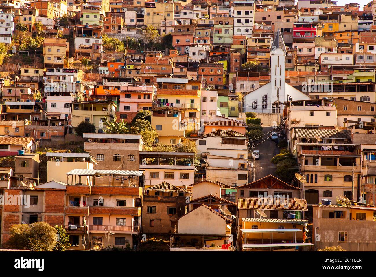 Coloured houses and church in a sloping city in Minas Gerais - Brazil ...