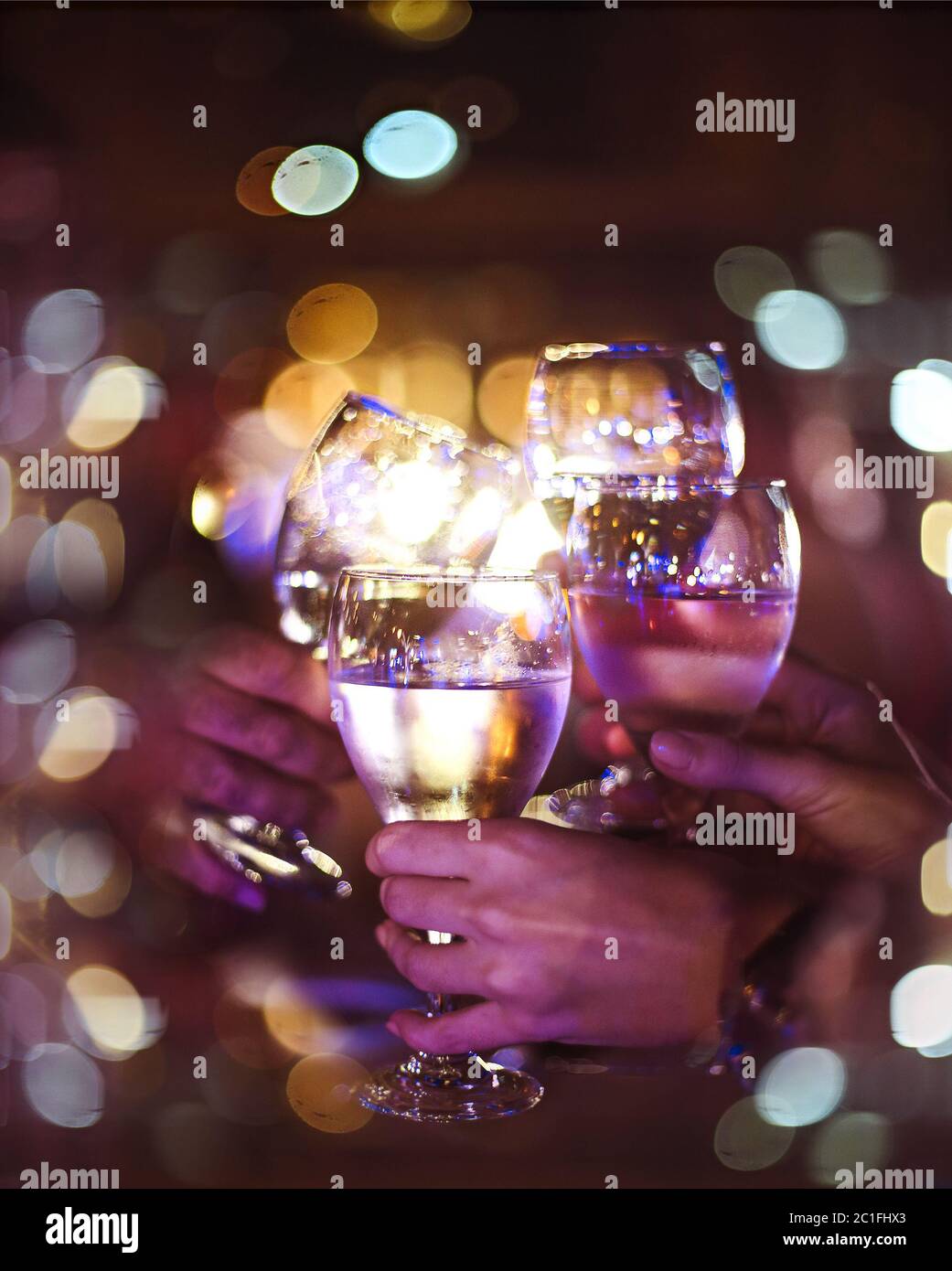 People toasting by wineglasses Stock Photo - Alamy