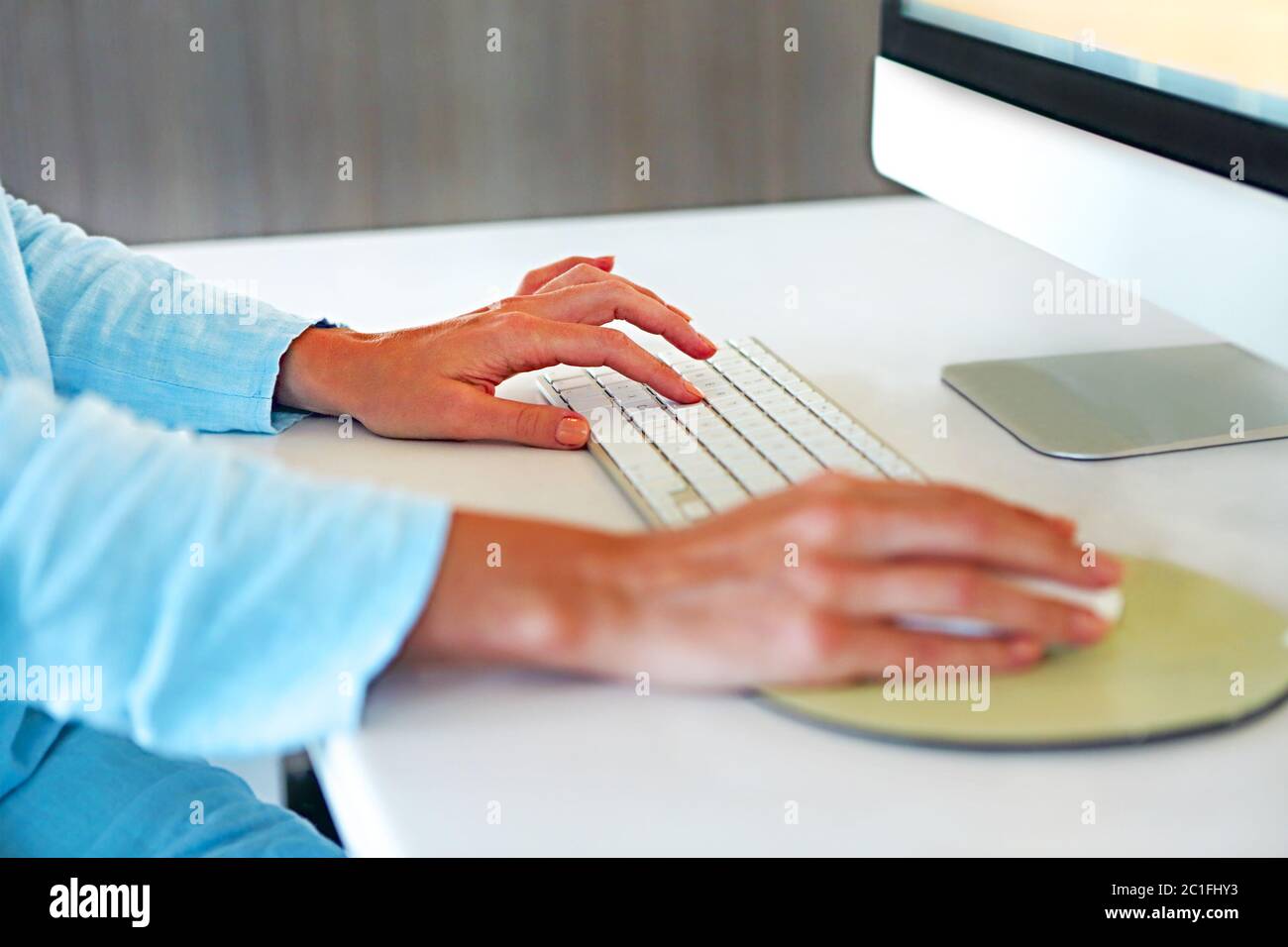 Young caucasian woman with computer Stock Photo - Alamy