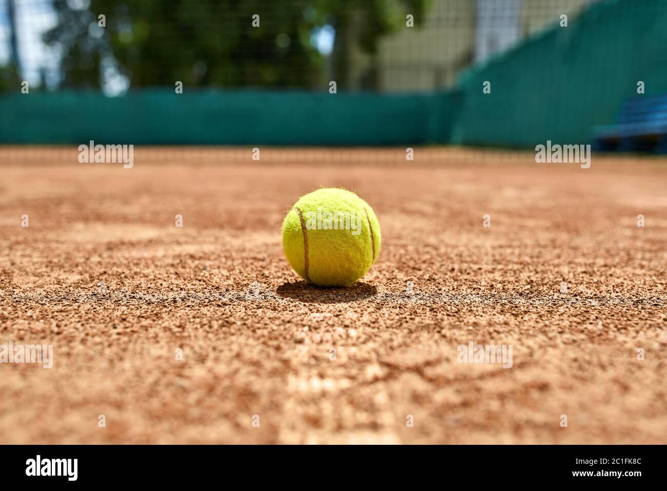 Tennis ball on ground Stock Photo - Alamy