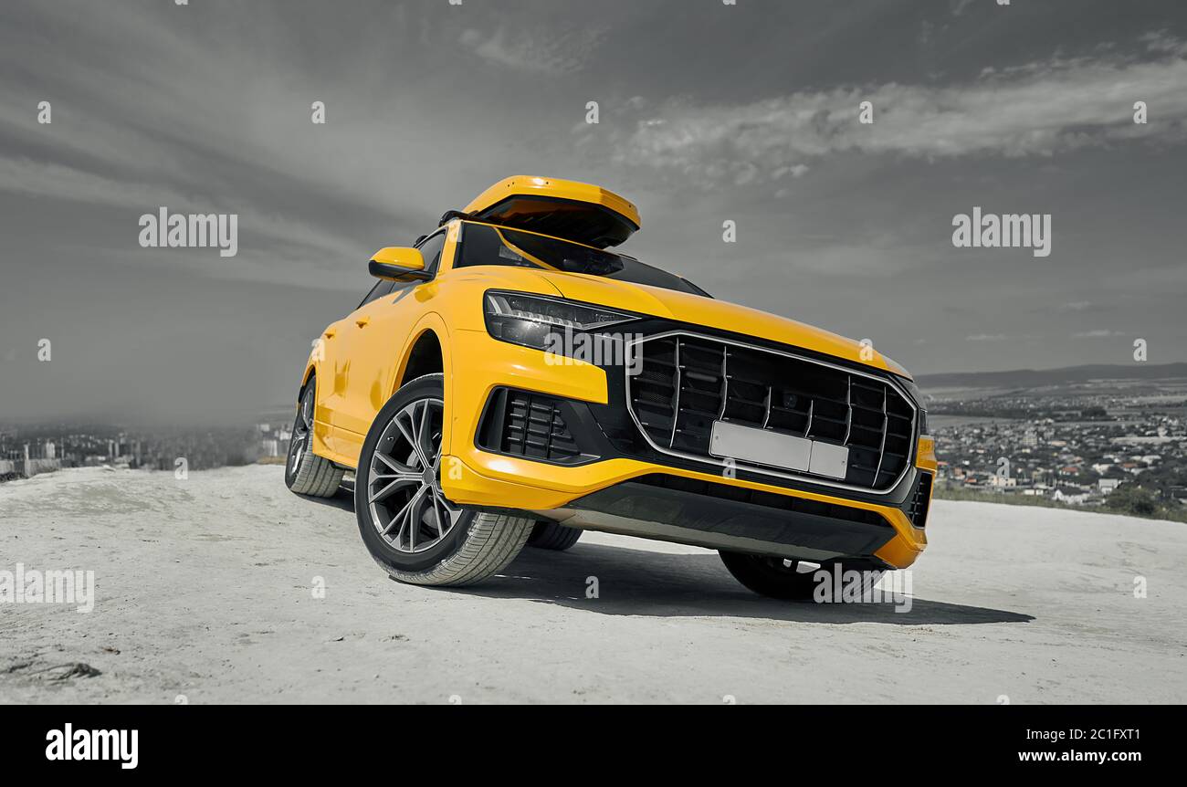 SUV on a rock by the sea Stock Photo - Alamy