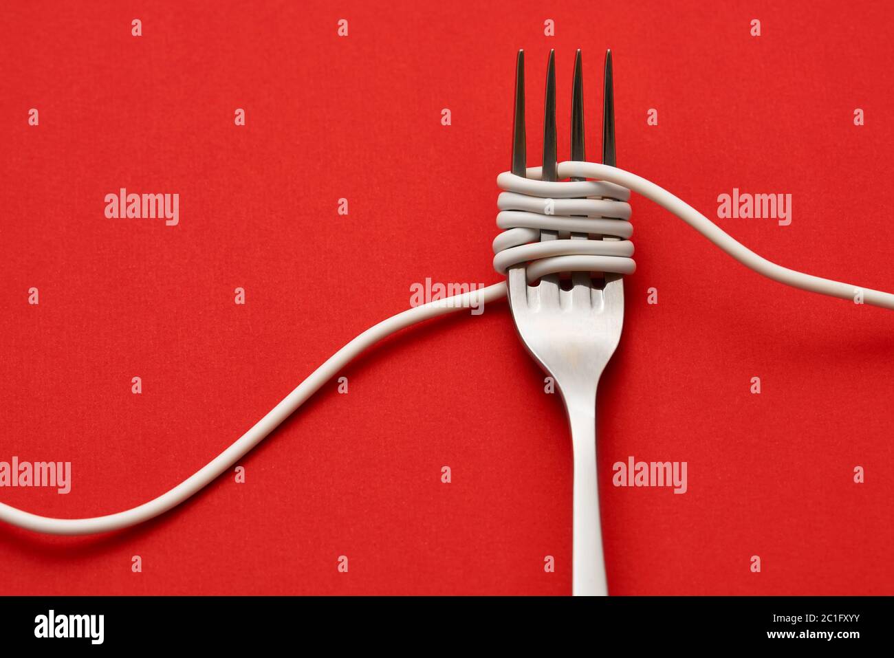 Fork wrapped with cable Stock Photo - Alamy