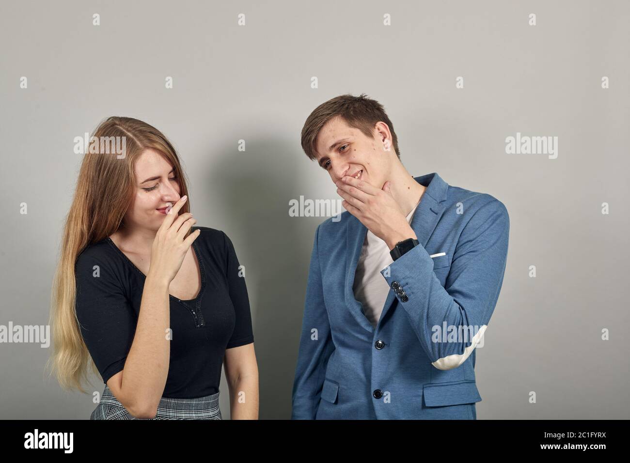 Woman laughing hand over mouth hi-res stock photography and images - Alamy
