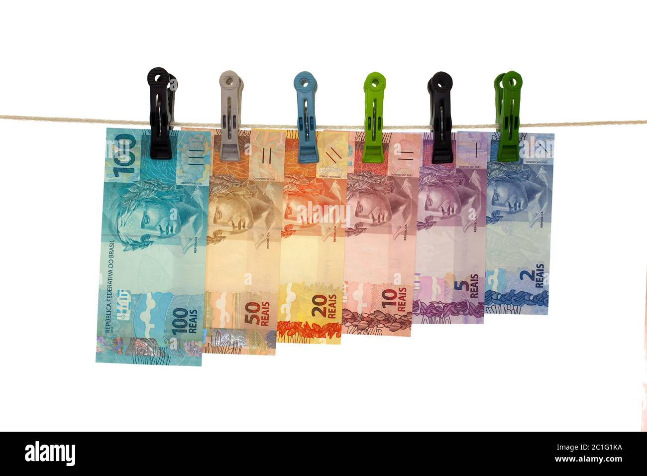 Brazilian Real bank notes in a clothesline - Money laundering - dirty ...