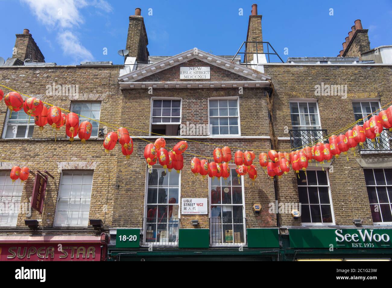 Lisle Street in London's Chinatown with shop front windows and Chinese ...