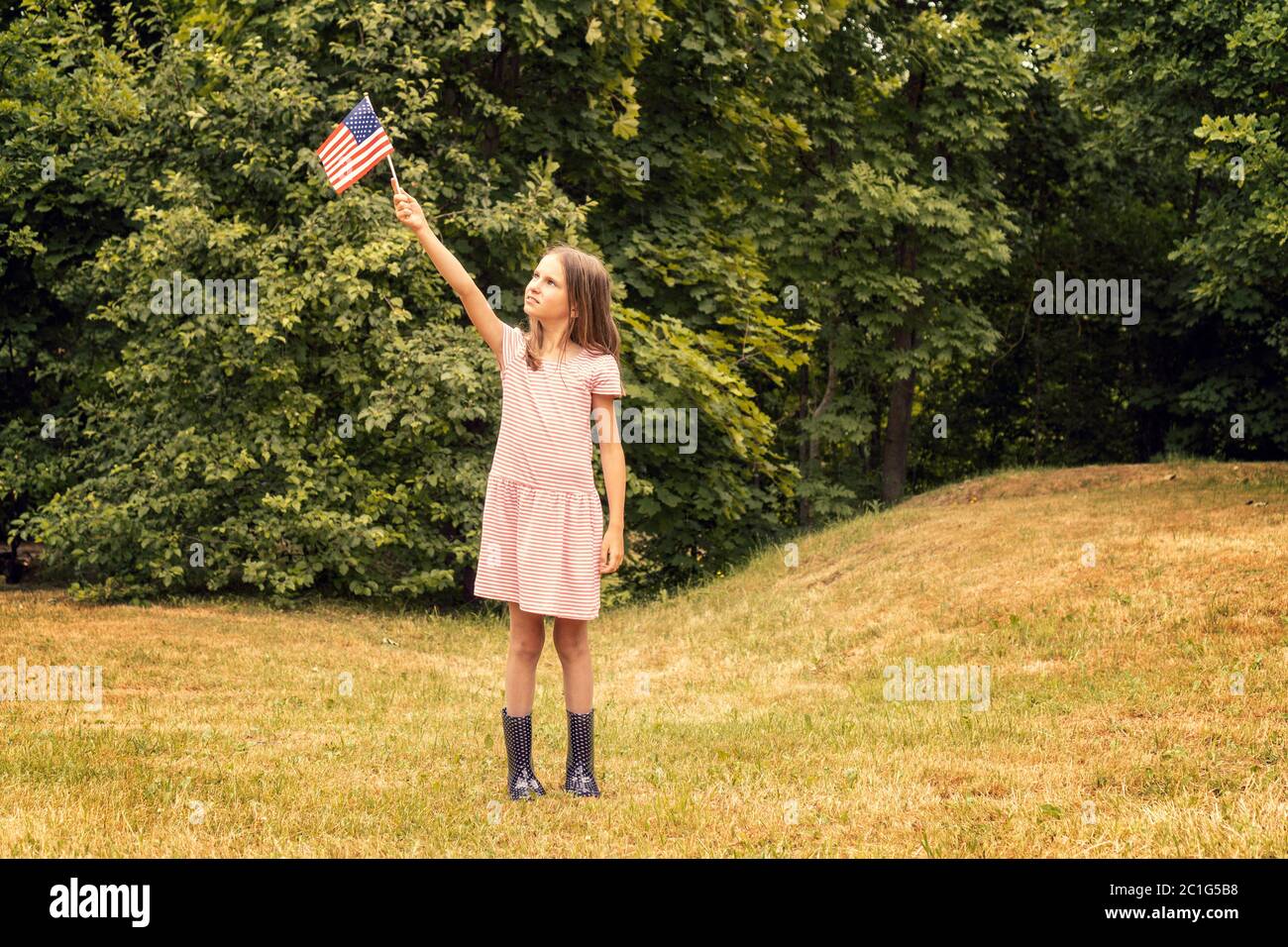 Child girl with small american flag Stock Photo - Alamy