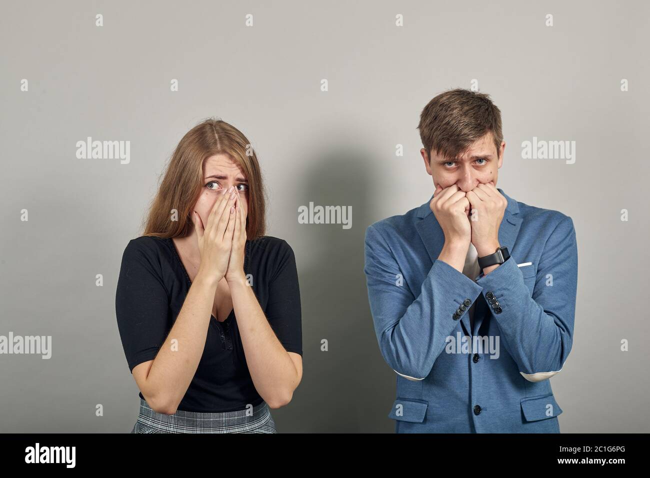 Scared, biting fists emotionally. Covering mouth behind knuckle. Having ...