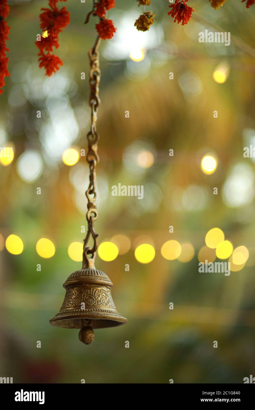 Old bronze bells in indian temple with green background. Hindu temple ...