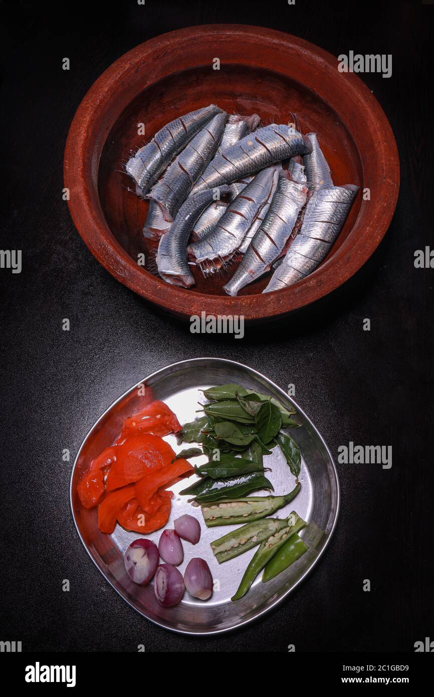 Cutting sardines hi-res stock photography and images - Alamy