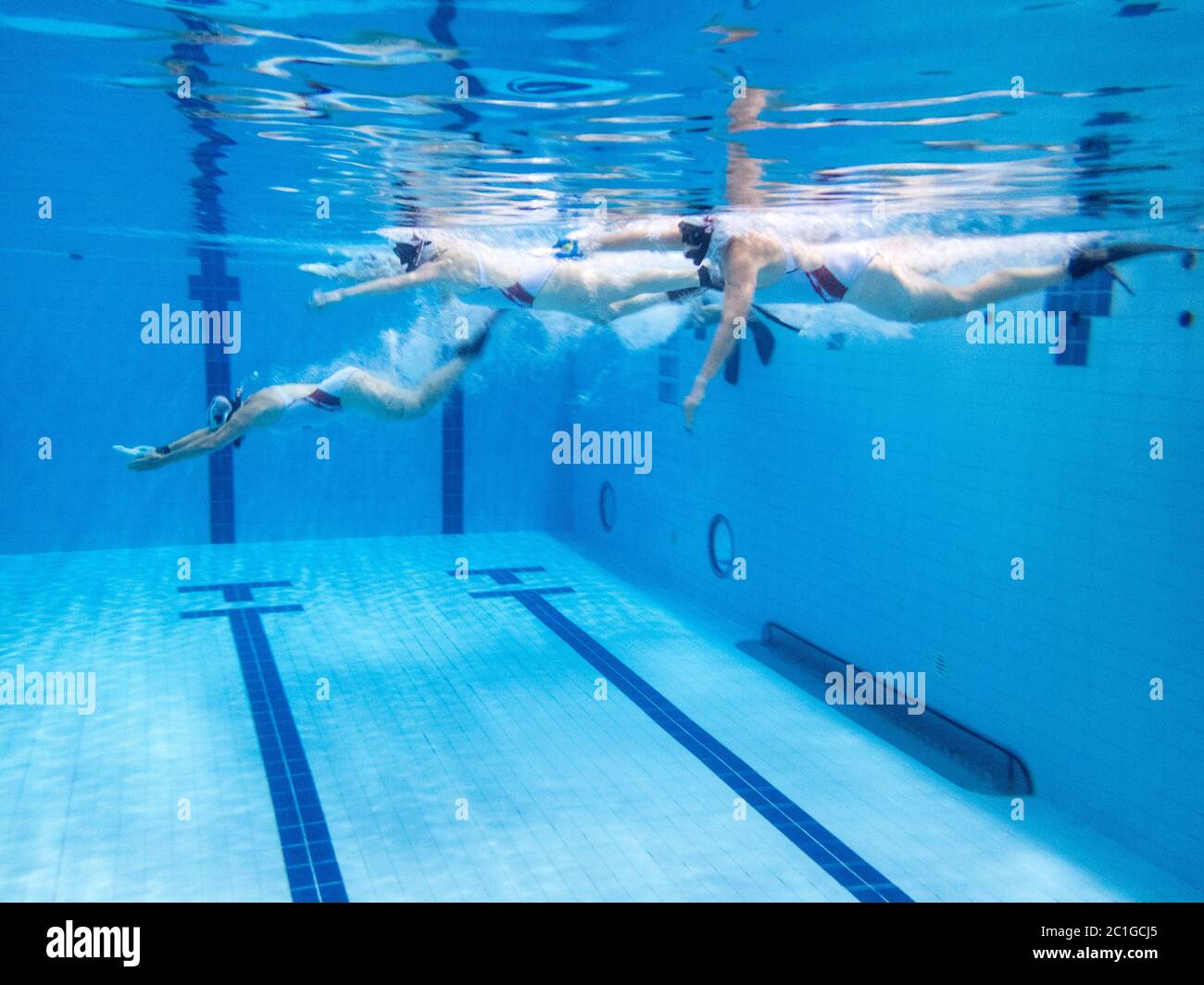 Canadian women athletes diving underwater at a game of underwater ...