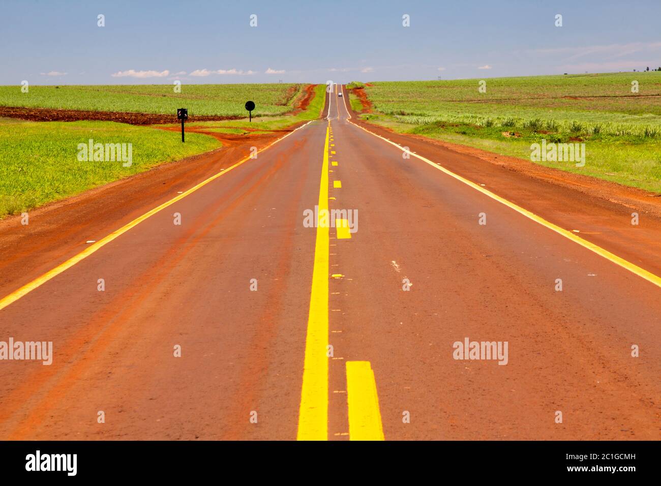 Empty road in a very hot day showing light refraction in the horizon in ...