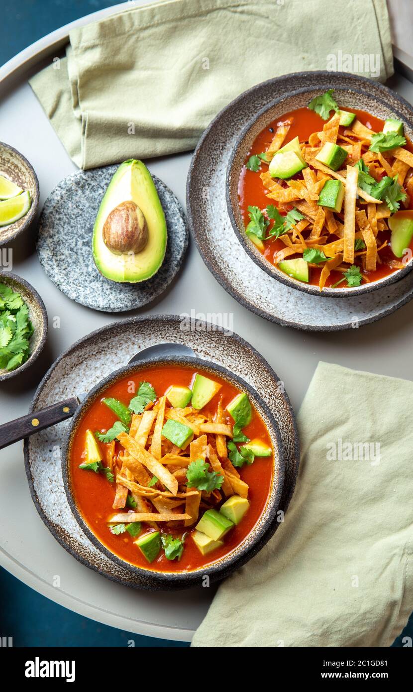 Mexican style table with spicy aztec soup with fried tortilla. Sopa ...
