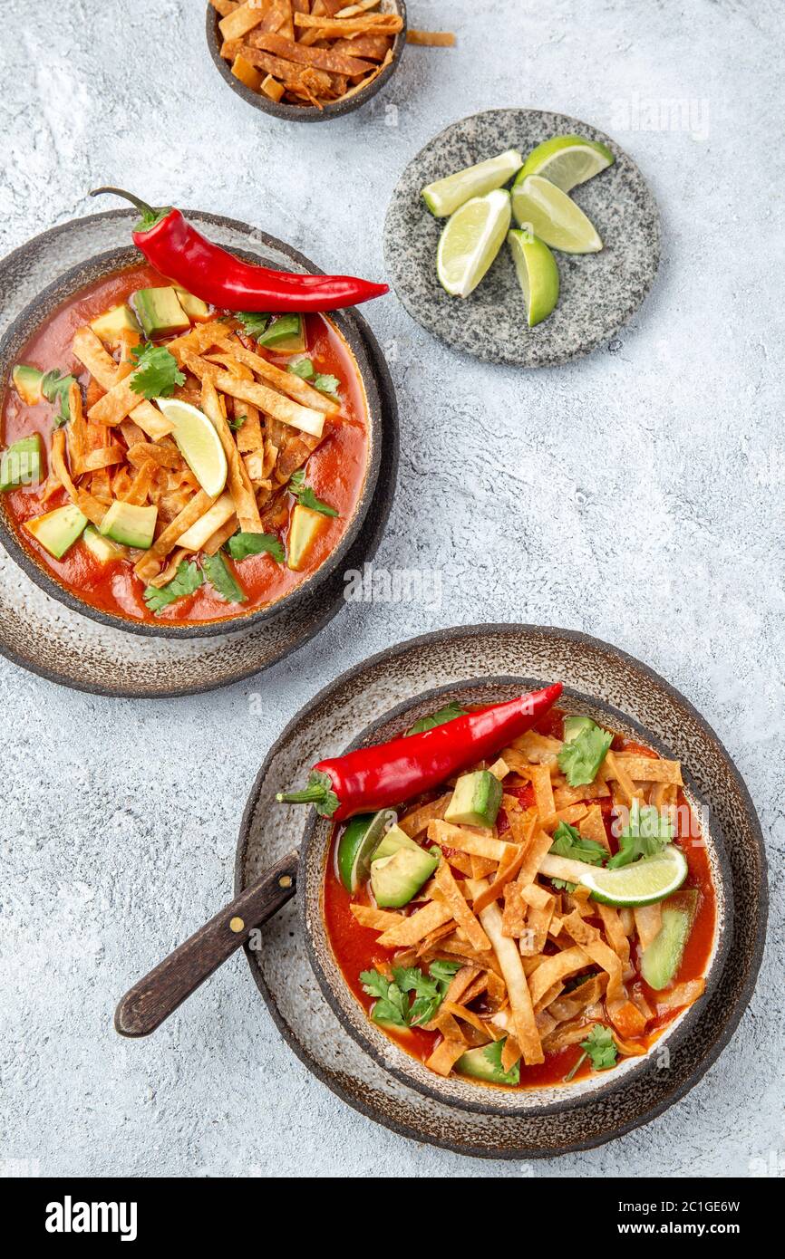 Aztec soup. Mexican sopa azteca with fried tortilla . Top view Stock ...