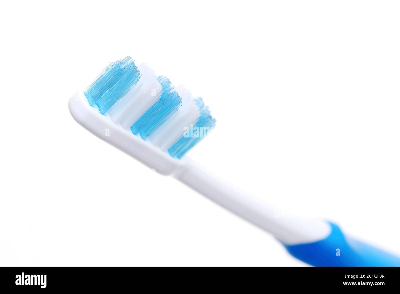 Blue toothbrush isolated on a white background Stock Photo - Alamy