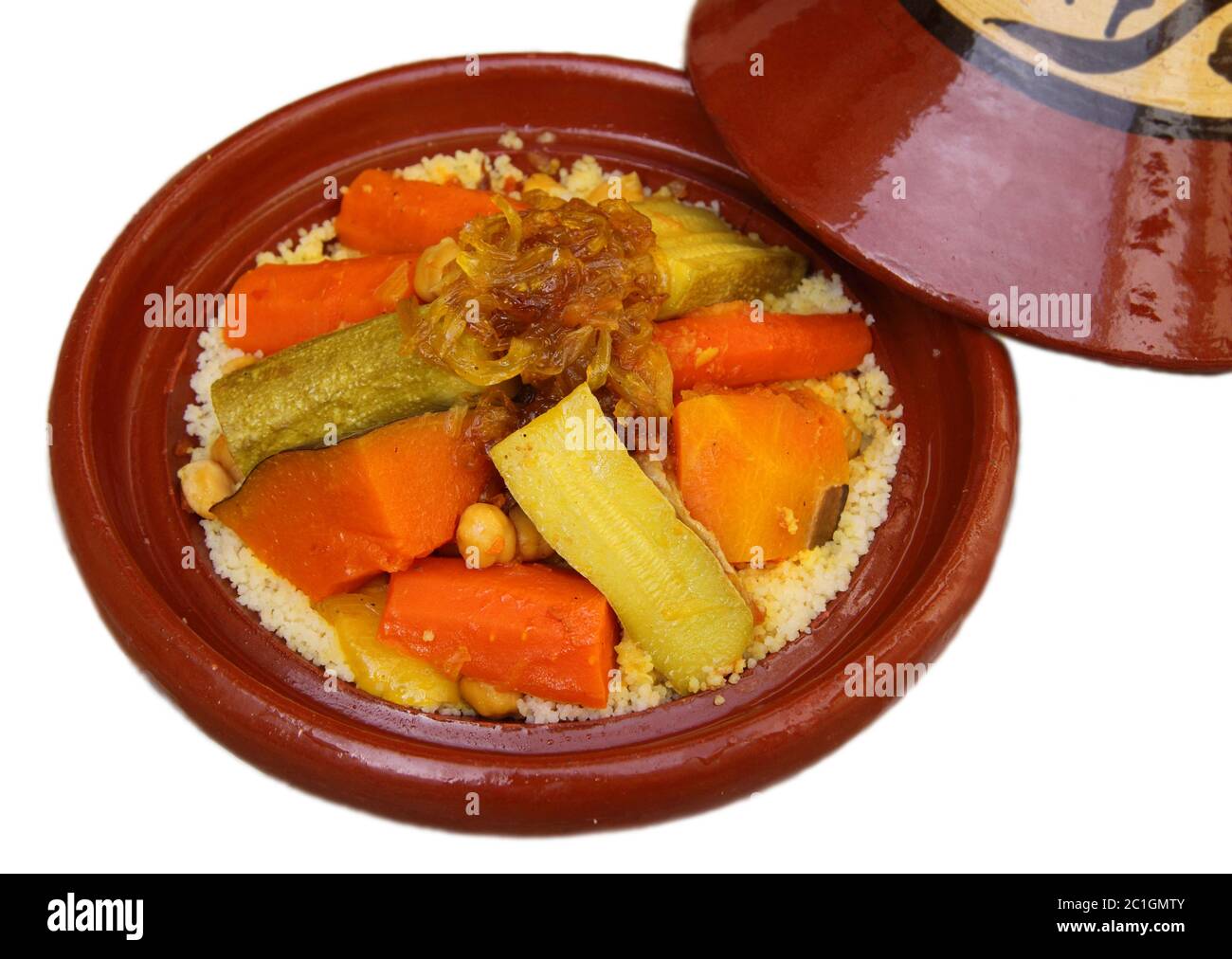 Moroccan food. Typical Clay tagine with couscous, vegetables and ...