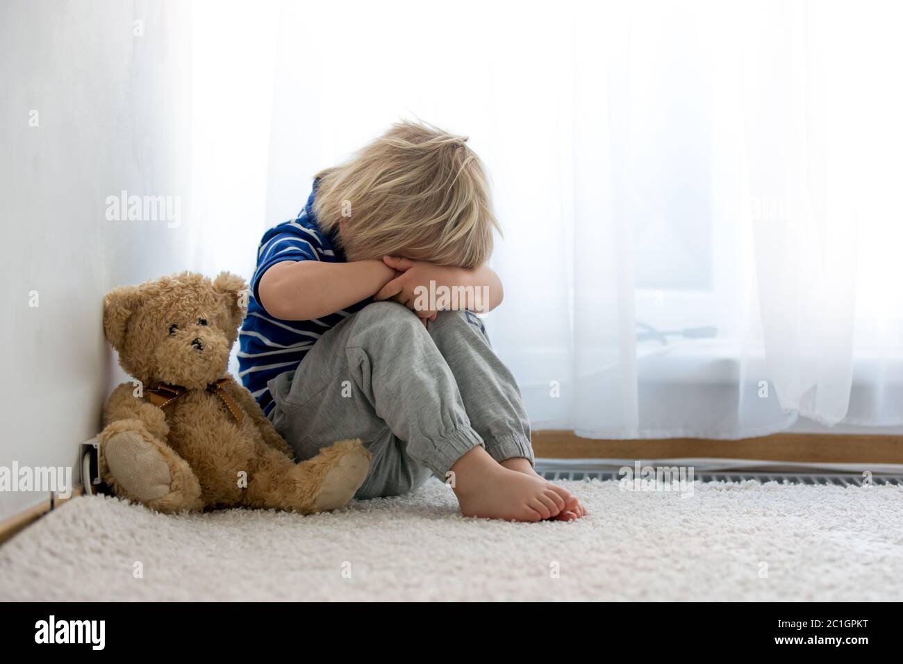 Child, toddler boy, punished in the corner for making mischieves Stock ...
