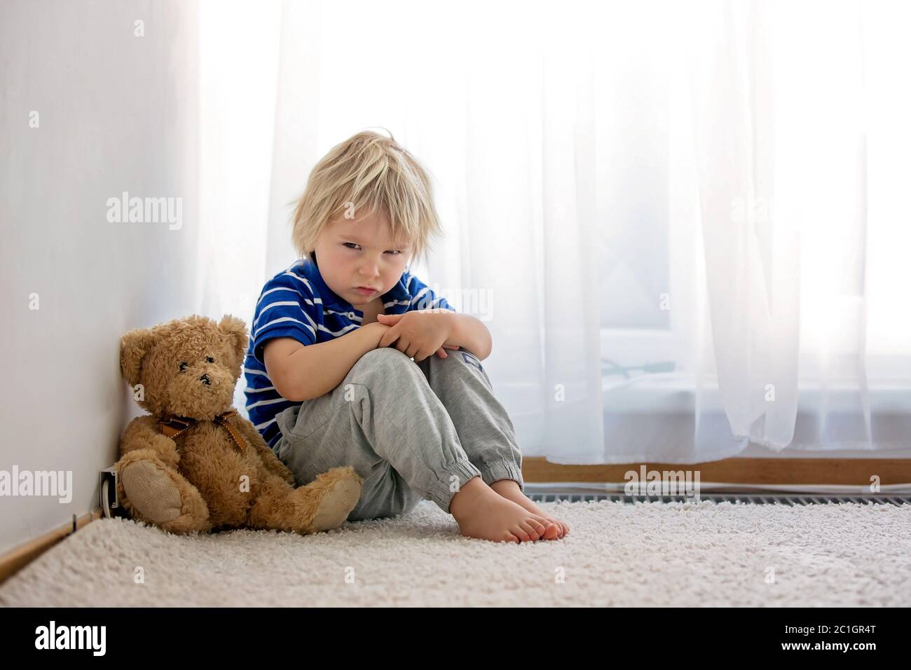 Child, toddler boy, punished in the corner for making mischieves Stock ...