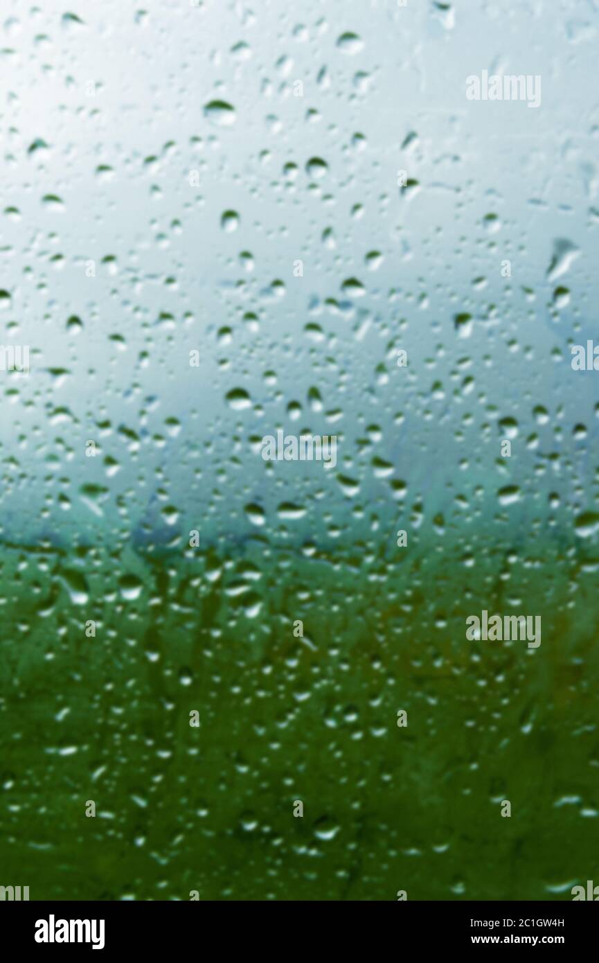 Natural background Drops on both sides of the glass from the rain and ...