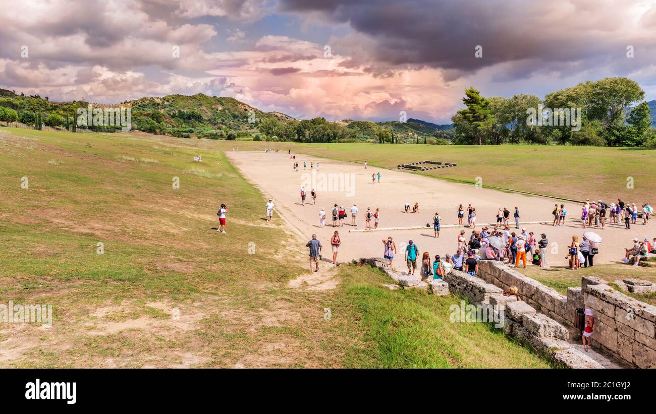 Olympia, Greece - September 7, 2014: Tourists entering crypt. Crypt is ...