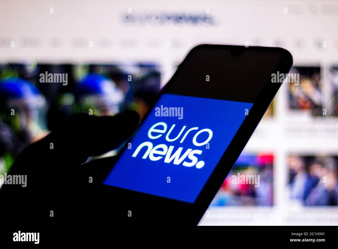 In this photo illustration the Euronews logo seen displayed on a ...