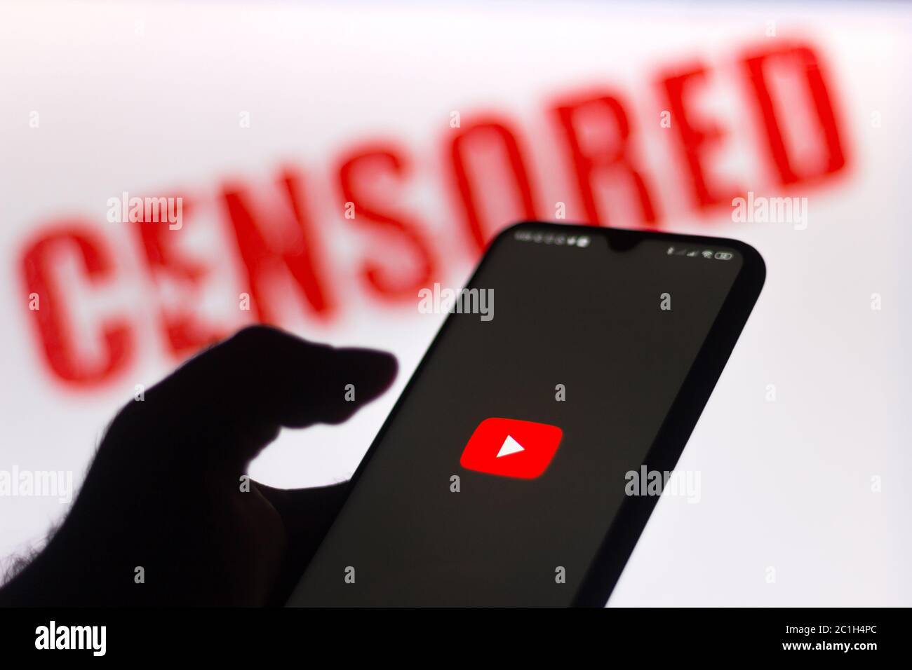 In this photo illustration the YouTube logo is displayed on a ...