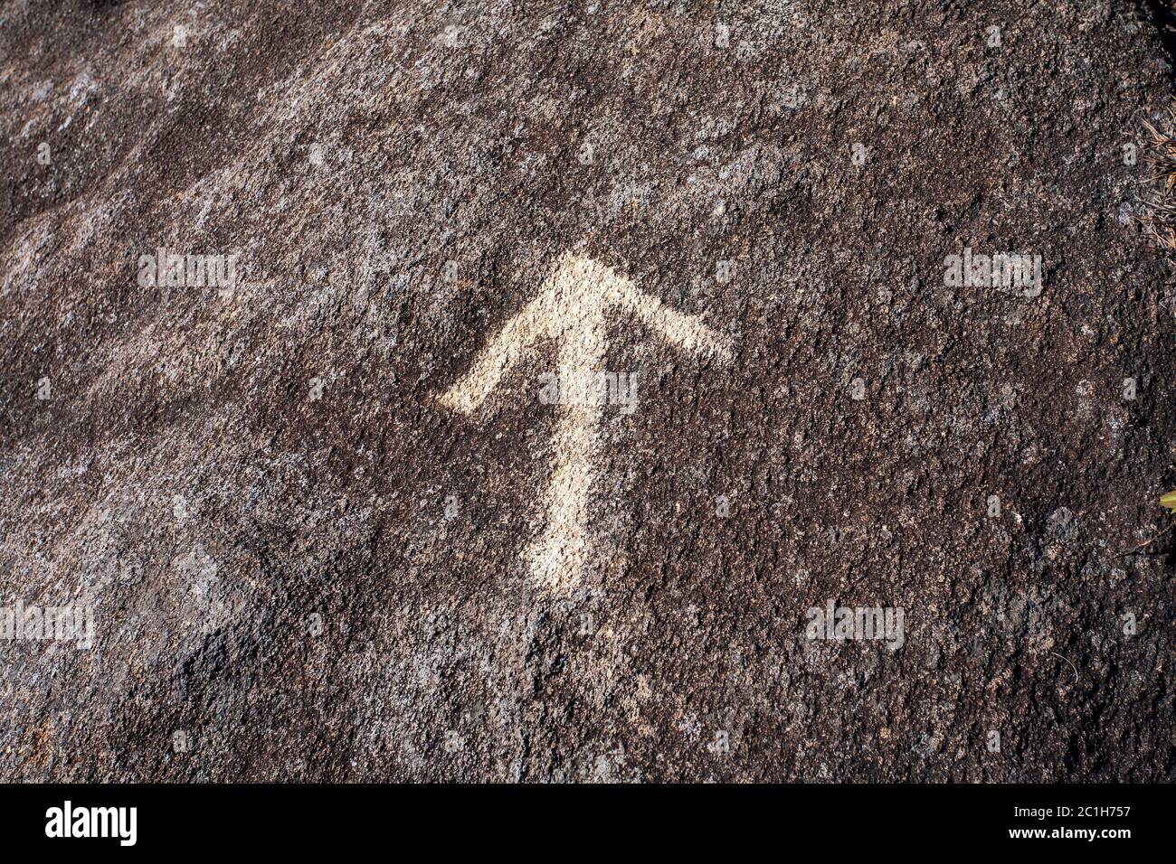 Arrow showing the way in a rock Stock Photo - Alamy