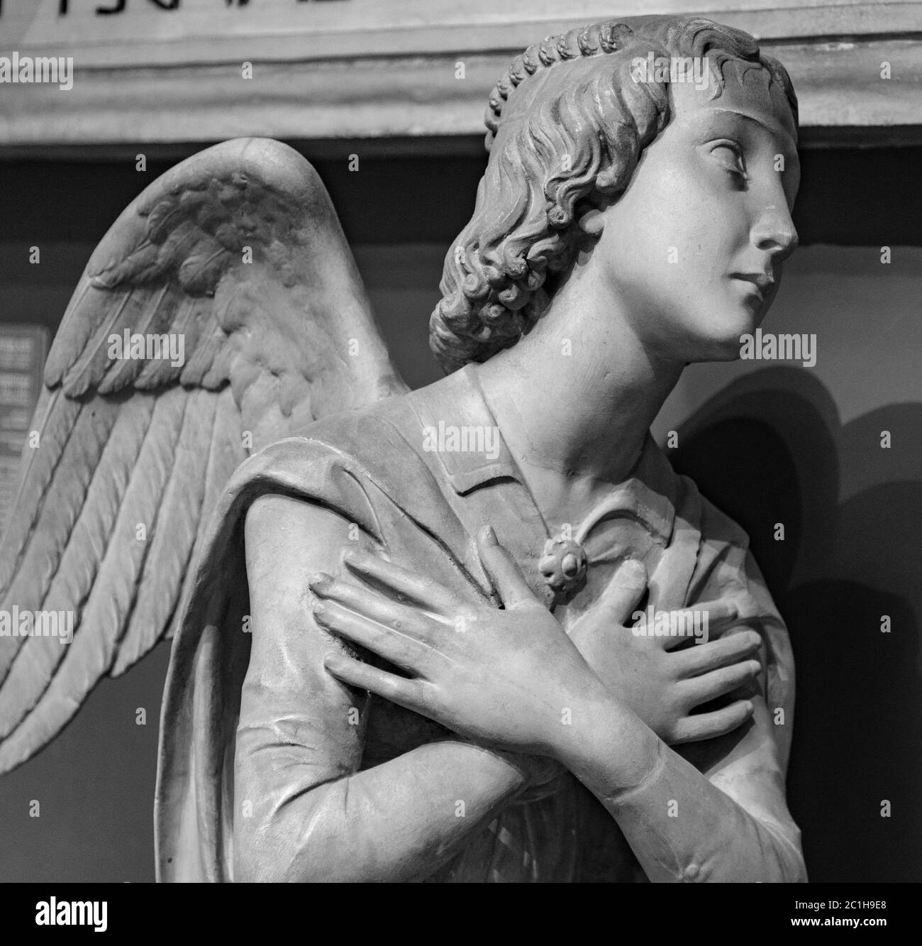 Angel stone ancient statue cemetery praying Black and White Stock ...