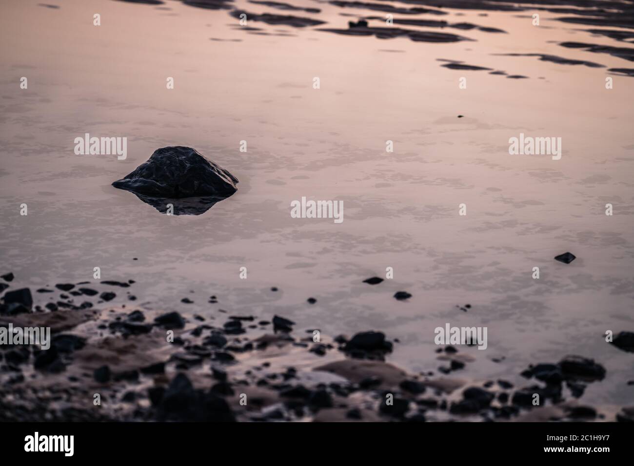 Reflection in rock pool and tourists hi-res stock photography and ...